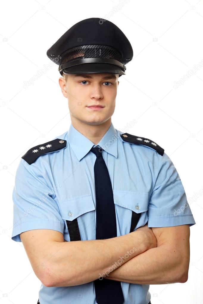 Young policeman with folded hands Stock Photo by ©petrdlouhy 64809941