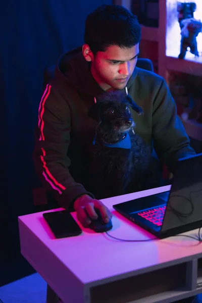 Young man doing a live video game sharing online. On different ...