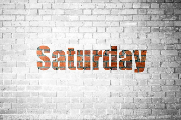 Red Brick wall texture with a word Saturday - Stock Image - Everypixel
