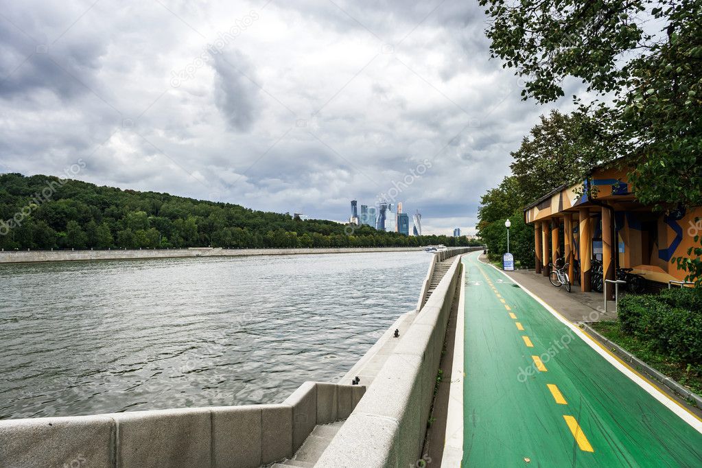 Bicycle path along the river quay — Stock Photo © sorokopud #52791149