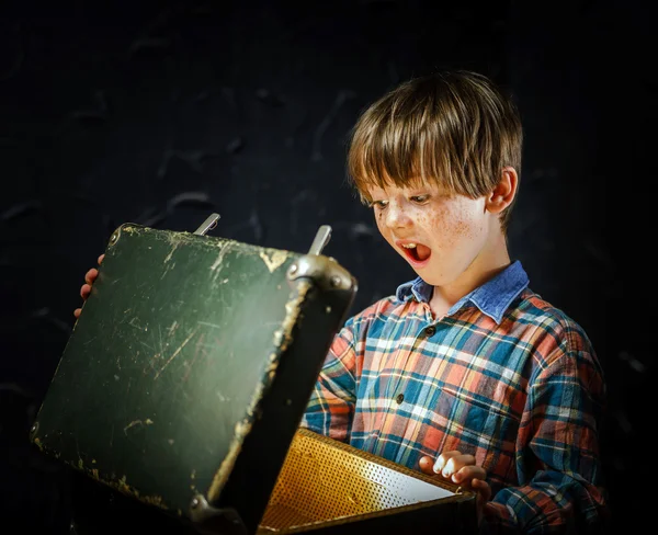 Little boy finding treasure Stock Photo by ©sorokopud 53230375