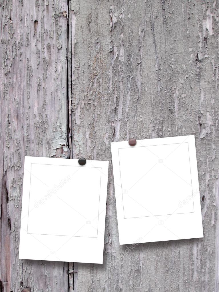 Two blank square instant photo frames with pins on grungy scratched ...