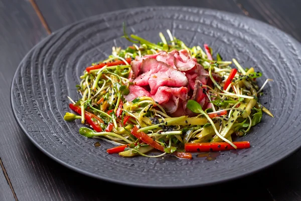 Authentic salad with bacon fresh red pepper, sprouts, sesame and ...