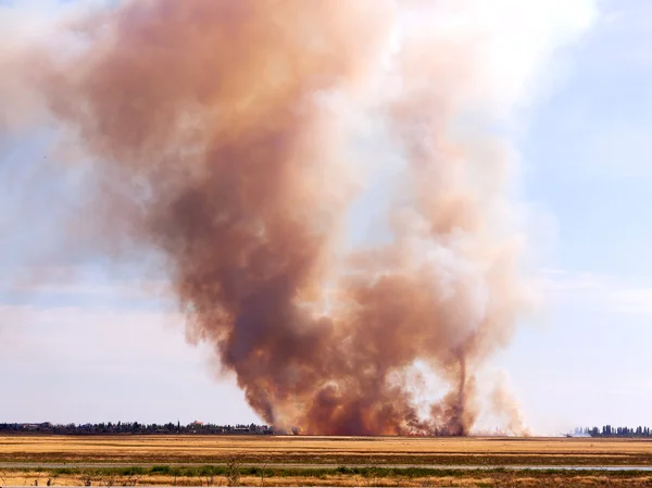 The fire and heavy smoke in the desert near the settlement durin ...