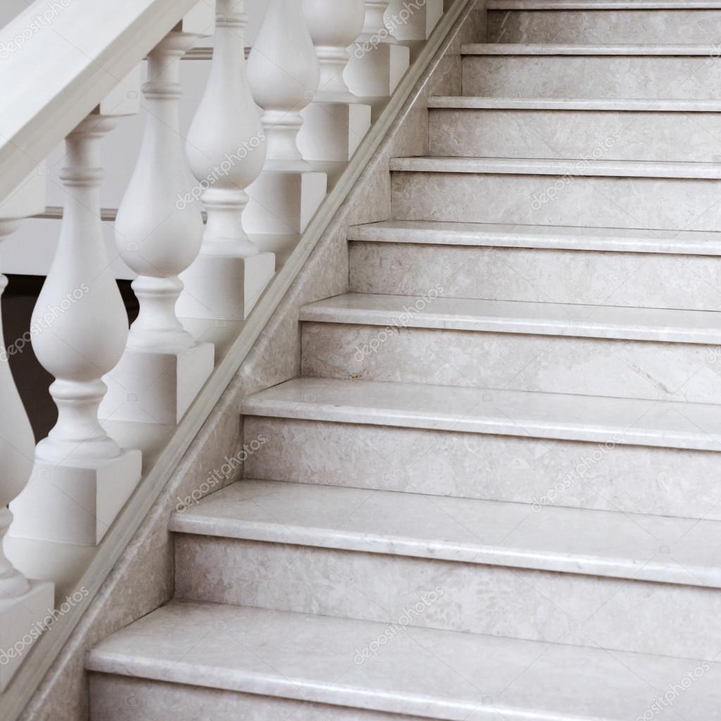 Staircase of white marble with decorative elements in soft natur ...