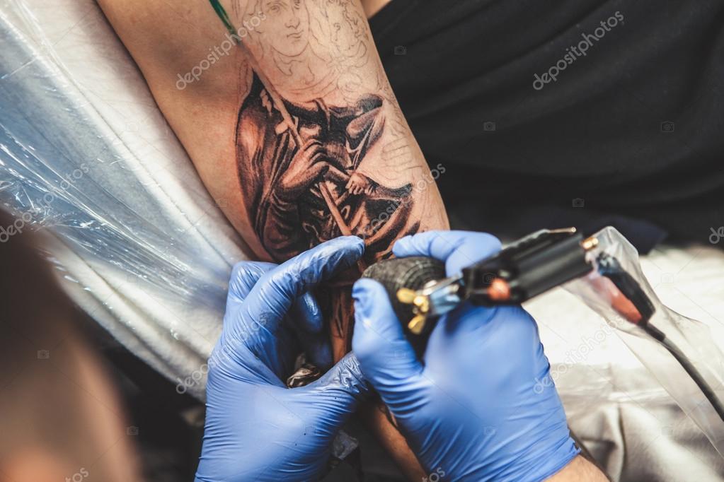 Master tattoo artist Stock Photo by ©Mikhail_Kayl 106827966