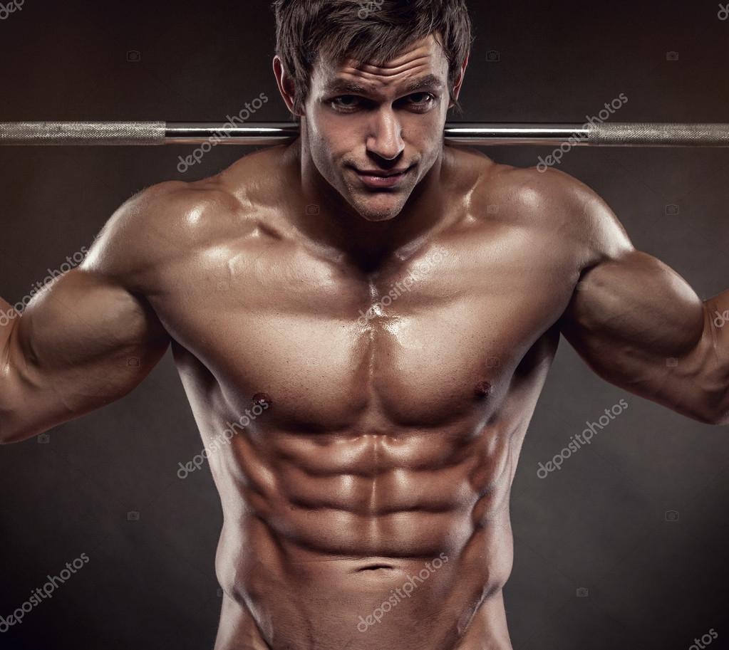 Muscular bodybuilder guy doing exercises with dumbbells — Stock Photo ...