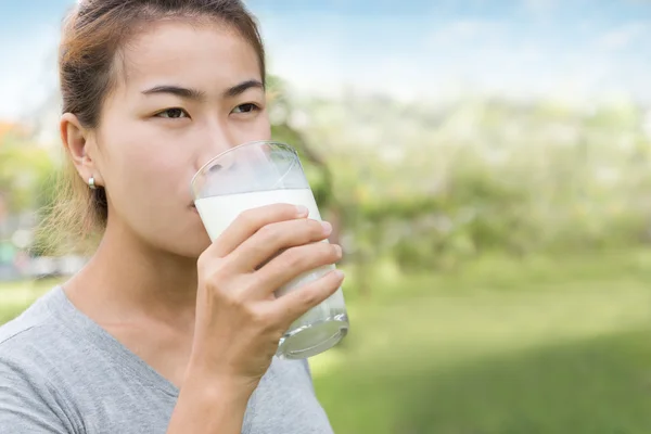Women drinking milk healthy lifestyle outdoor - Stock Image - Everypixel