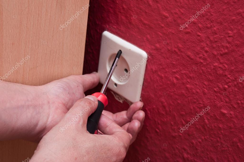 Man changing a electrical outlet ⬇ Stock Photo, Image by © NeydtStock ...