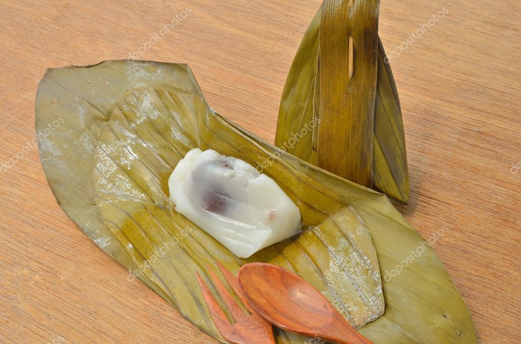 Thai dessert sticky rice wrapped in banana leaf Stock Photo by ...