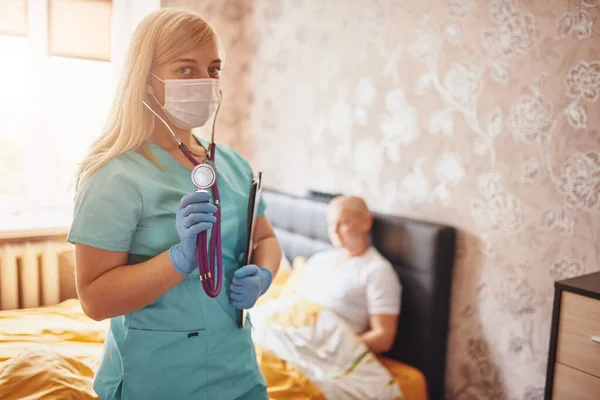 House call. The patient communicating with the doctor. Examinationing ...