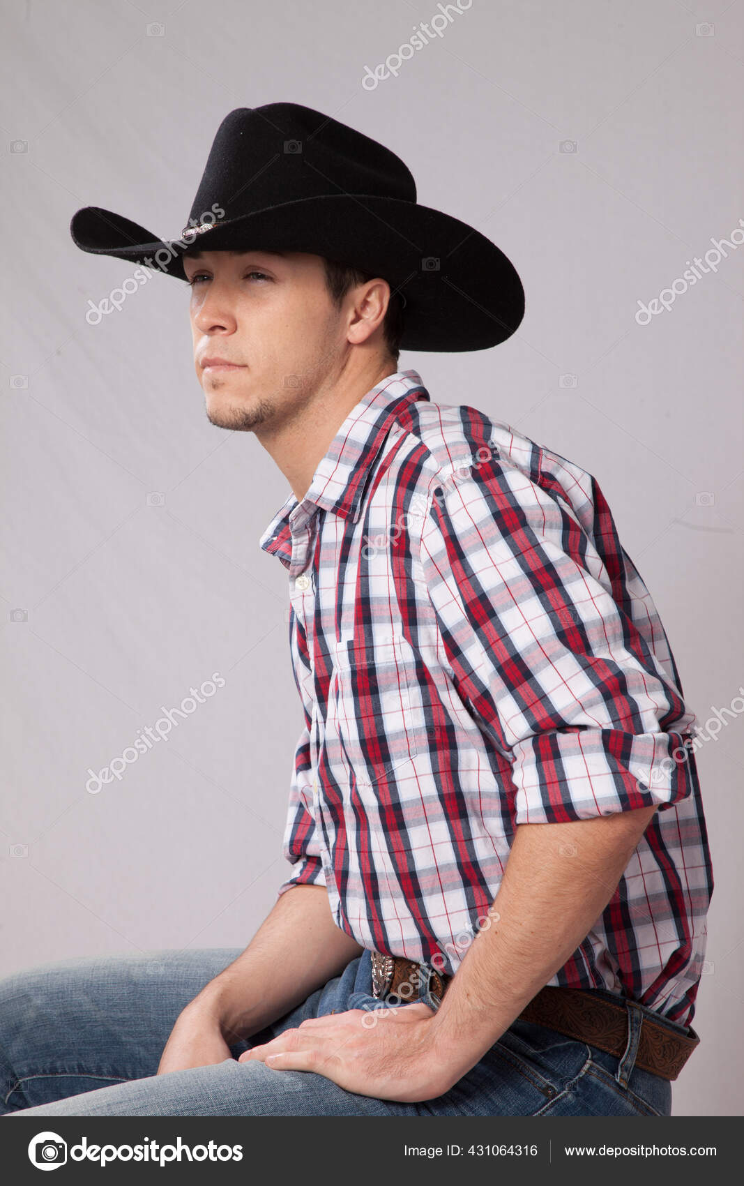 Cowboy Sitting Thoughtfully Resting Stock Photo by ©artistallen 431064316