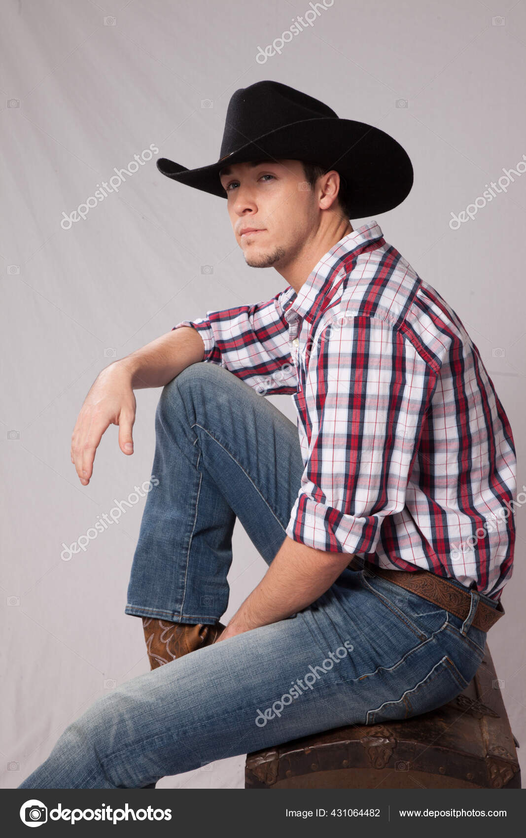Cowboy Sitting Thoughtfully Resting Stock Photo by ©artistallen 431064482