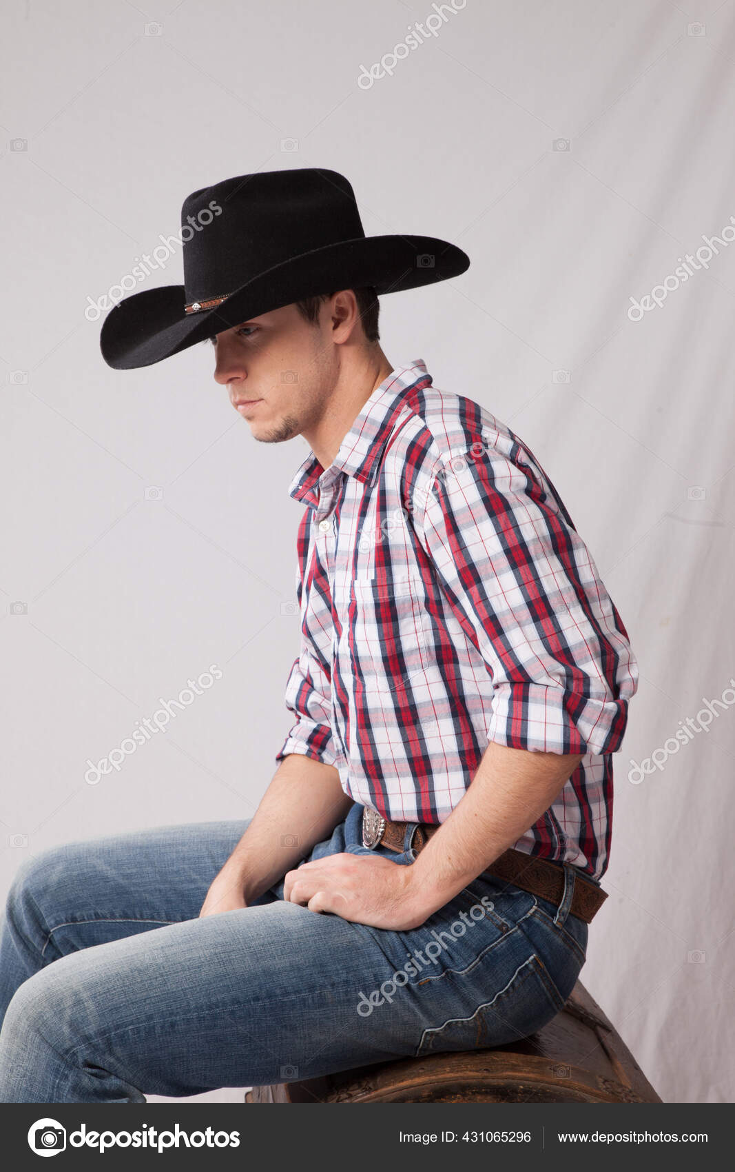 Cowboy Sitting Thoughtfully Resting Stock Photo by ©artistallen 431065296