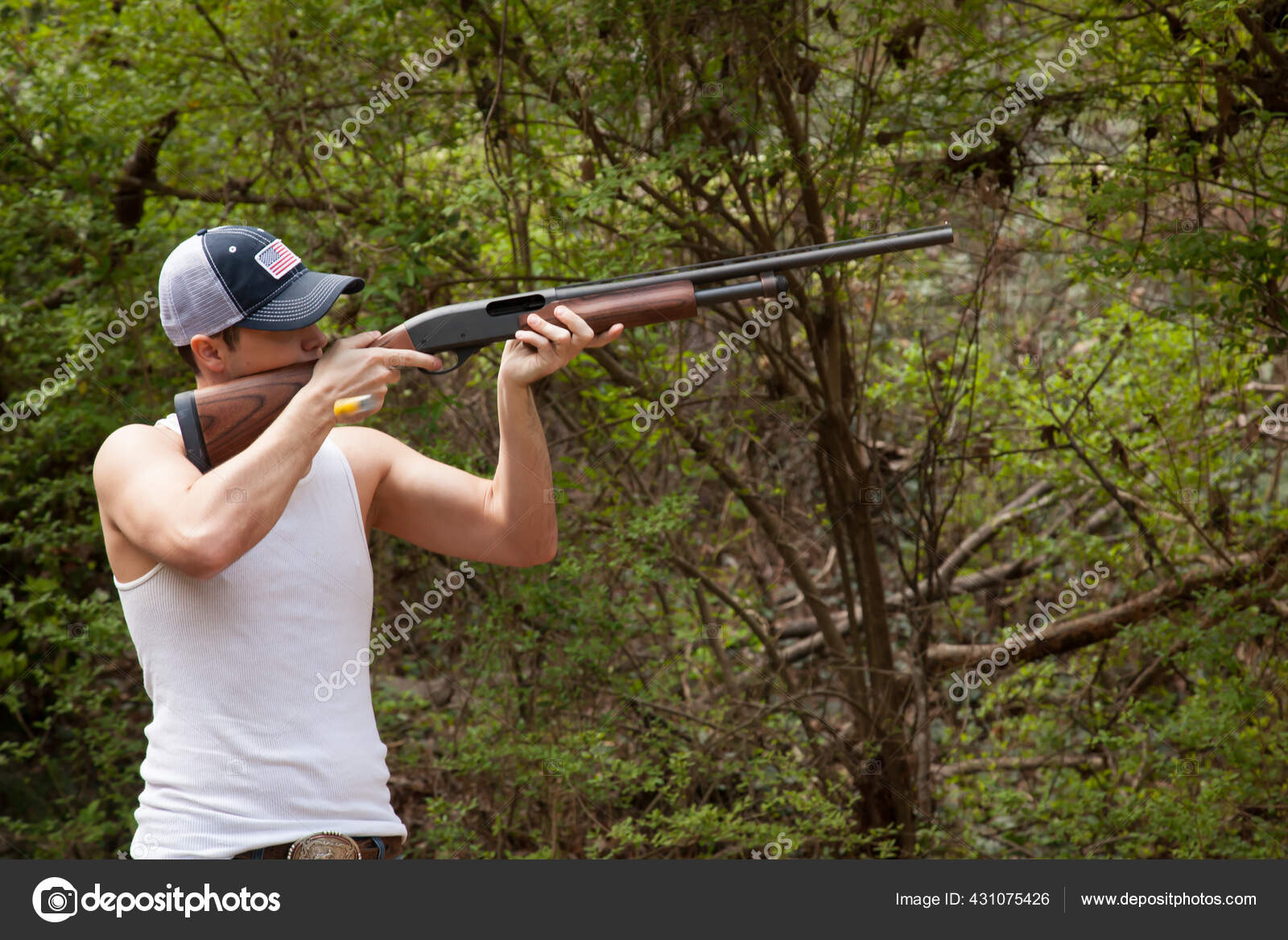 Handsome Man Pointing Shotgun — Stock Photo © artistallen #431075426