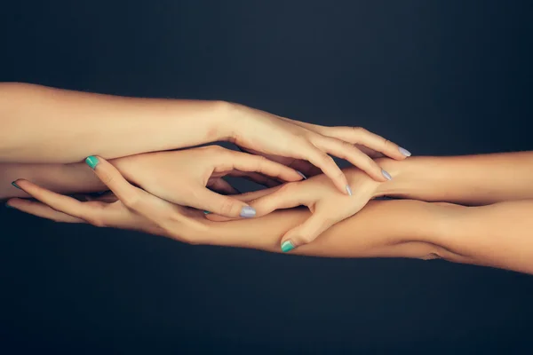 Four female hands touching - Stock Image - Everypixel