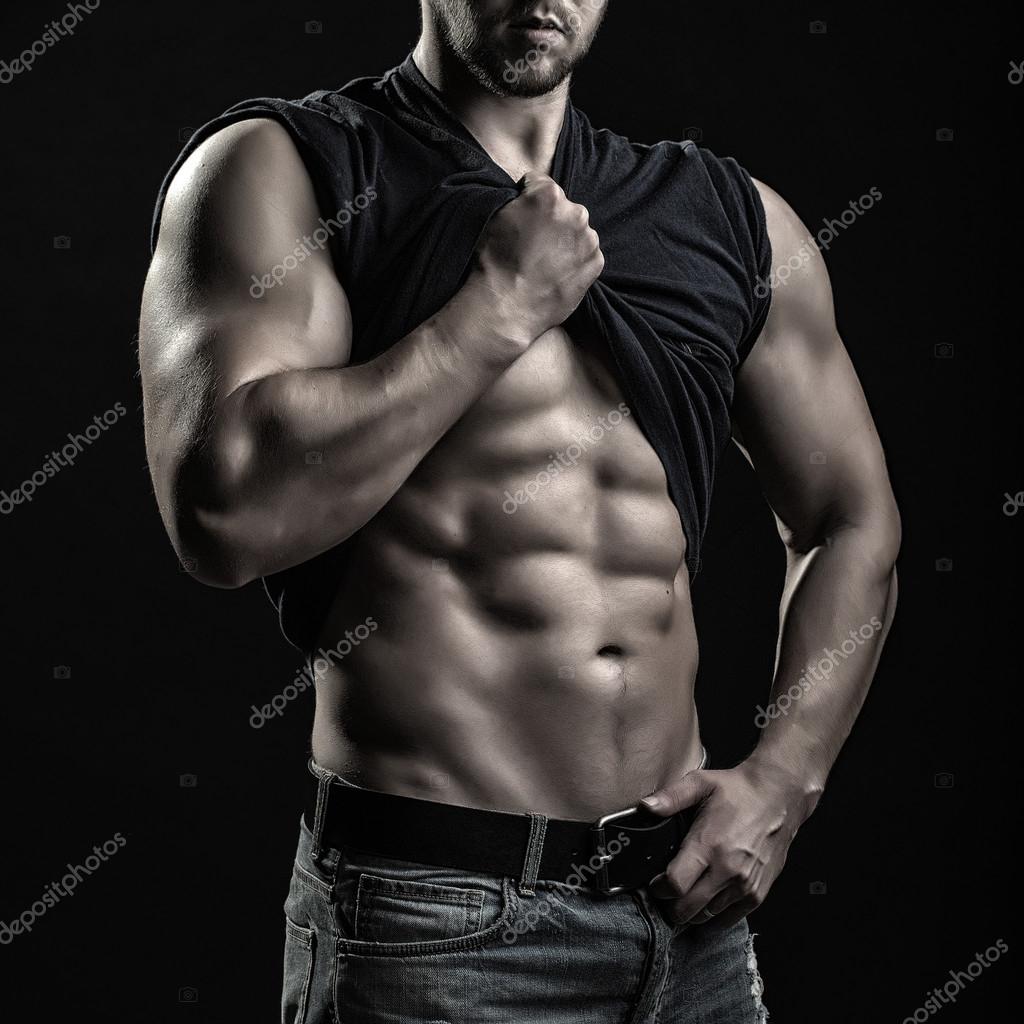 Muscular man with shirt on shoulder — Stock Photo © Tverdohlib.com ...
