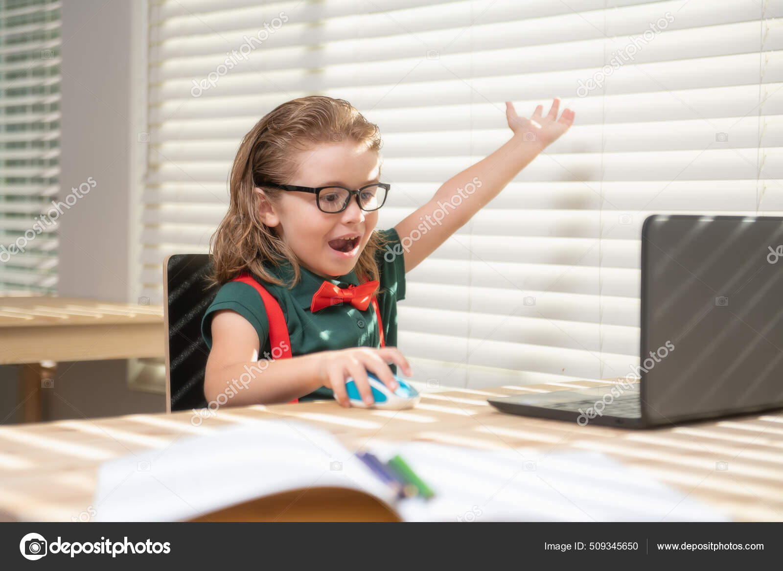 School boy pupil is studying online. Home schooling. Kids distance ...