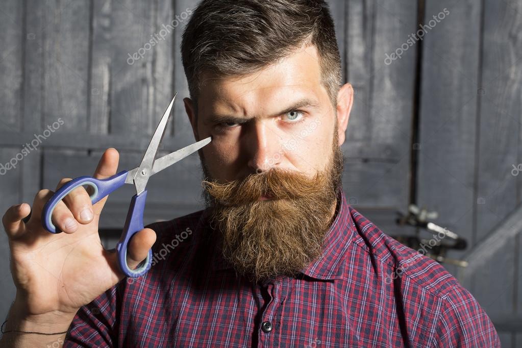 Unshaven man with scissors — Stock Photo © Tverdohlib.com #80244670