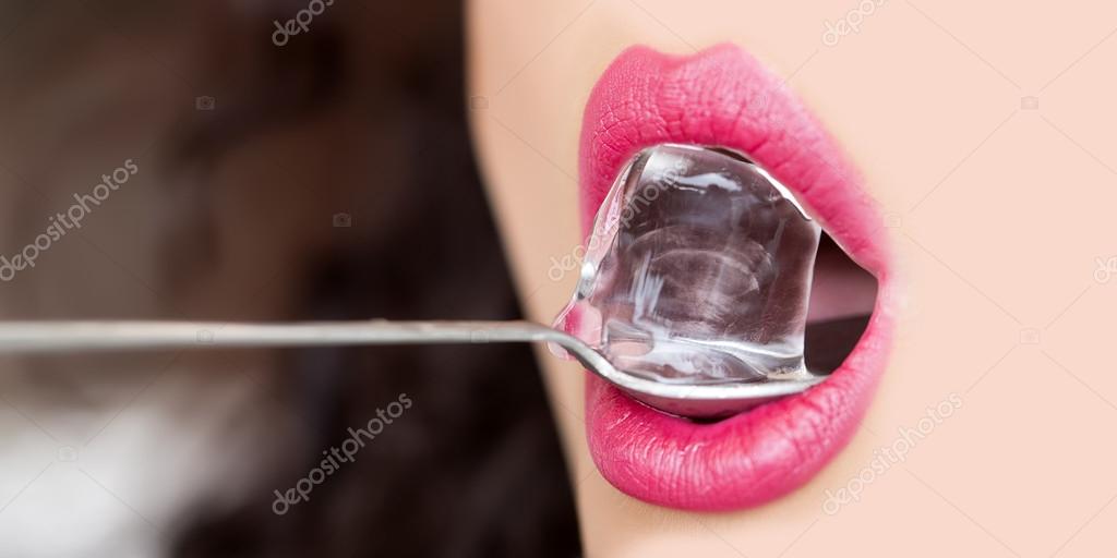Female mouth with ice cube Stock Photo by ©Tverdohlib.com 81164834