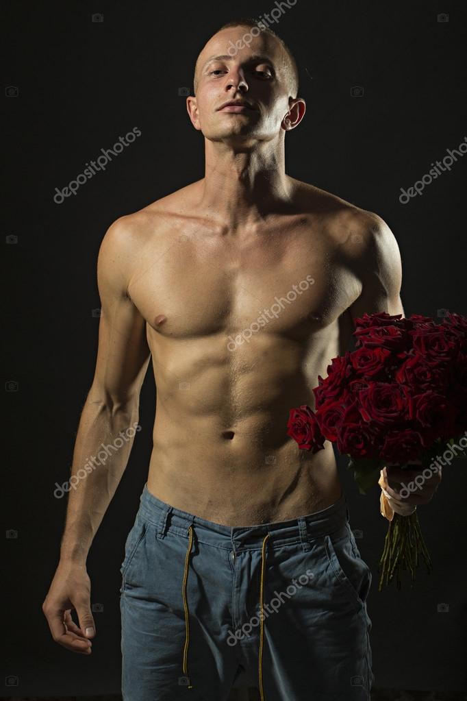 Man with rose bouquet — Stock Photo © Tverdohlib.com #81173260