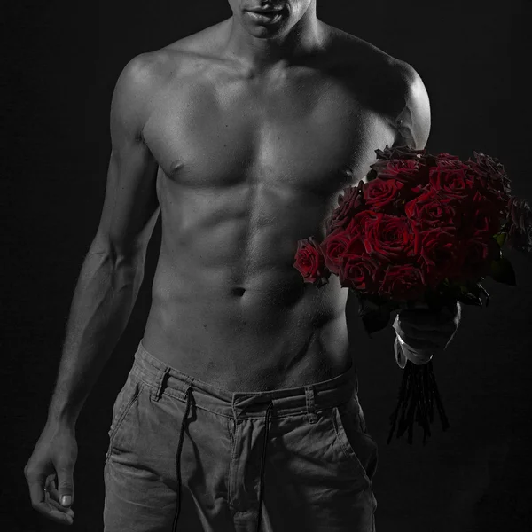 Man with rose bouquet — Stock Photo © Tverdohlib.com #81173260