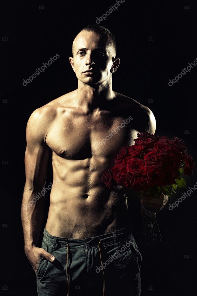 Man with rose bouquet — Stock Photo © Tverdohlib.com #81643718