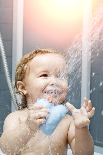 Smiling child in shower — Stock Photo © Tverdohlib.com #195969048