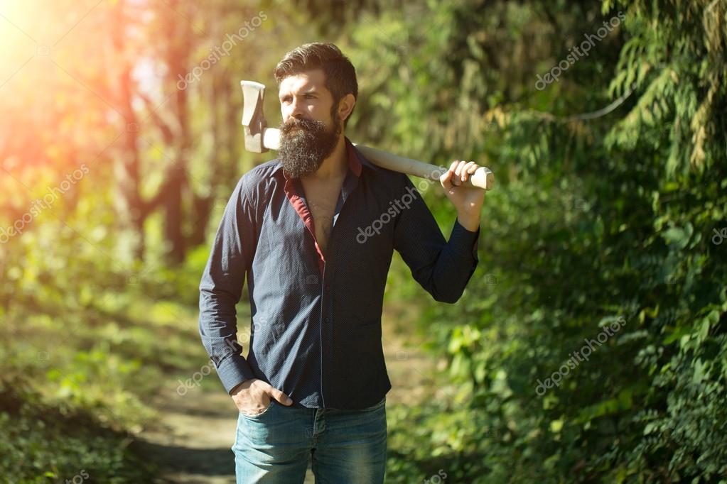 Man with axe outdoor — Stock Photo © Tverdohlib.com #87229930