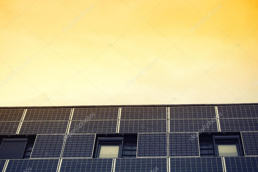 Solar panels against yellow sky — Stock Photo © Tverdohlib.com #87524468