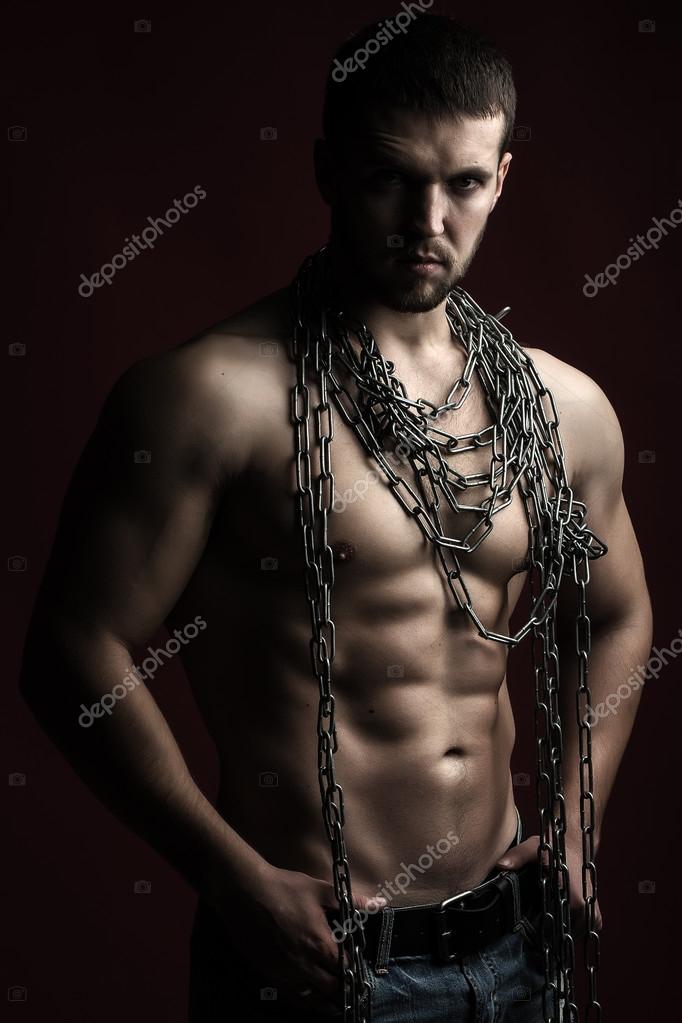 Muscular man with rope Stock Photo by ©Tverdohlib.com 90184982