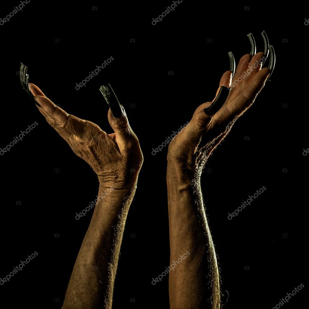 Old female hands with long nails — Stock Photo © Tverdohlib.com #94553716