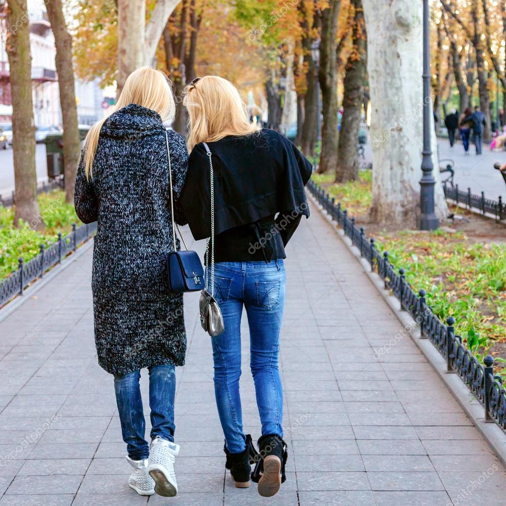 Two girls walking on the street — Stock Photo © AnnHaritonenko #75374211