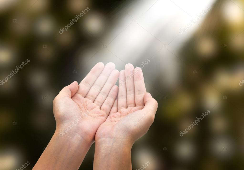 Woman giving or holding hands, glowing lights on hand Concept Stock ...