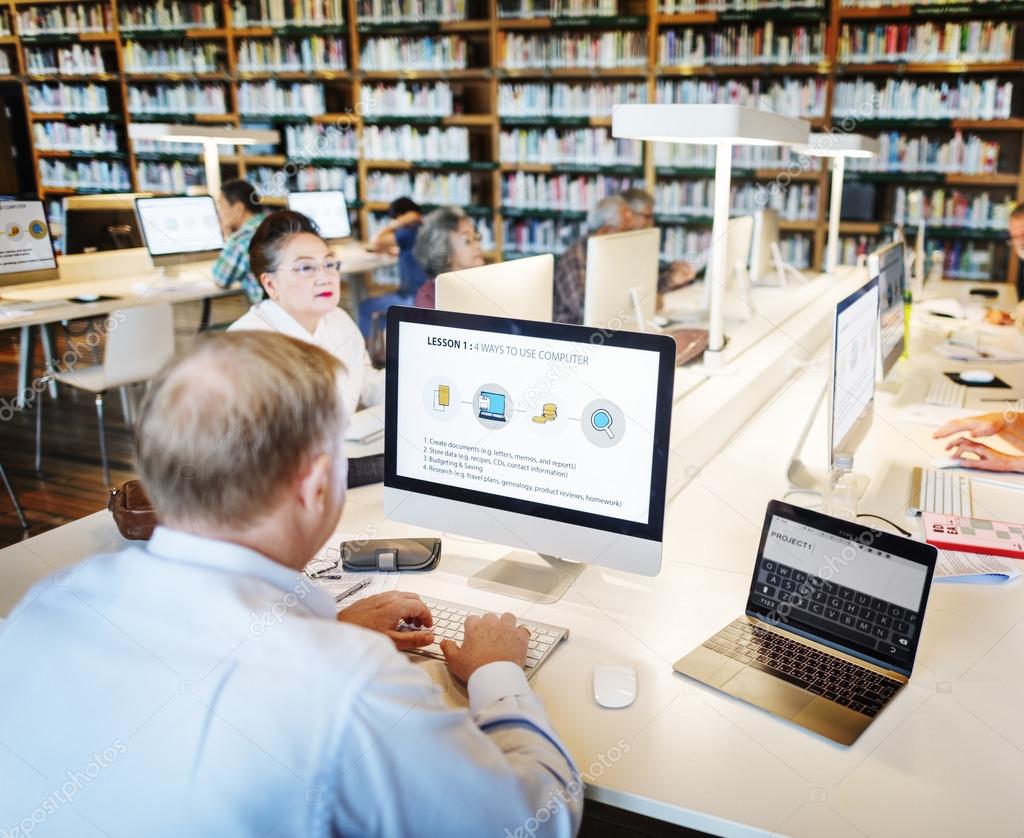 Senior adult students in computer class — Stock Photo © Rawpixel #109017602