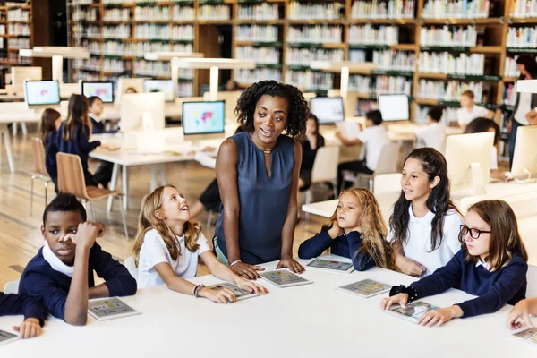 Pupils having lesson at school — Stock Photo © Rawpixel #107767318