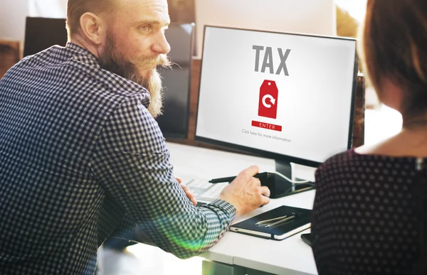 Businessman working on computer with tax - Stock Image - Everypixel