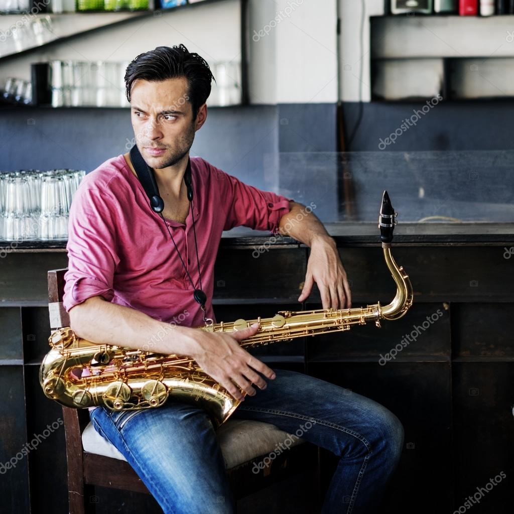 Handsome Jazzman with saxophone — Stock Photo © Rawpixel #113234194