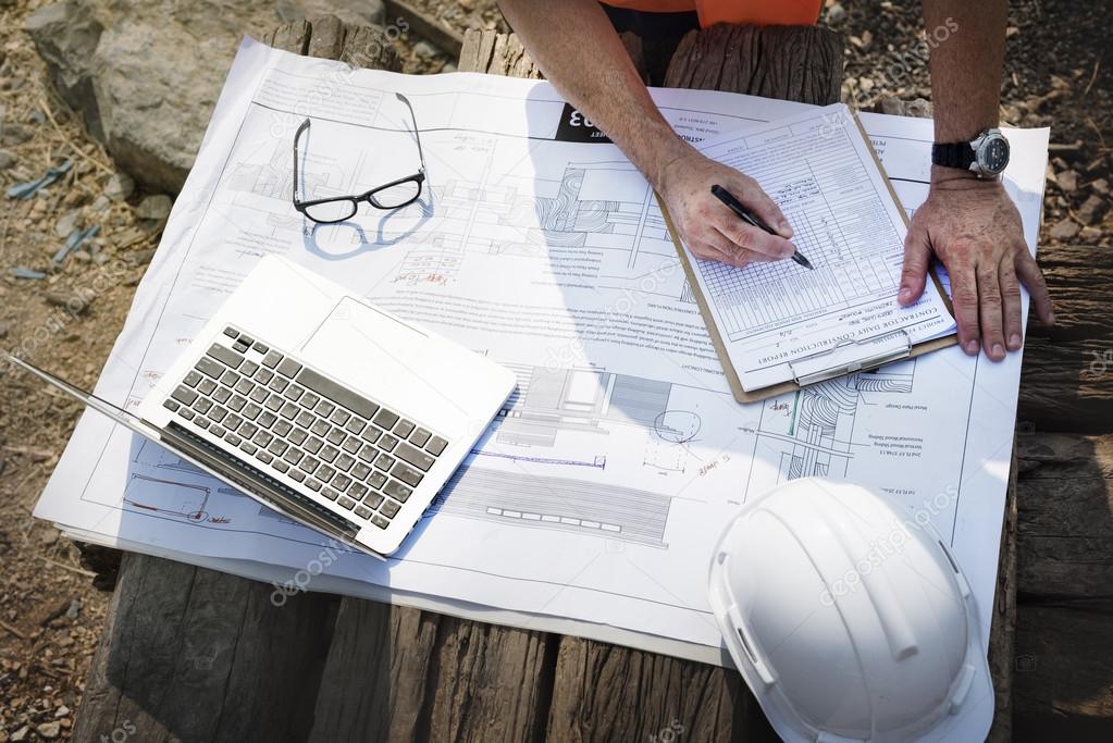 Construction Worker examines drawings Stock Photo by ©Rawpixel 114560852