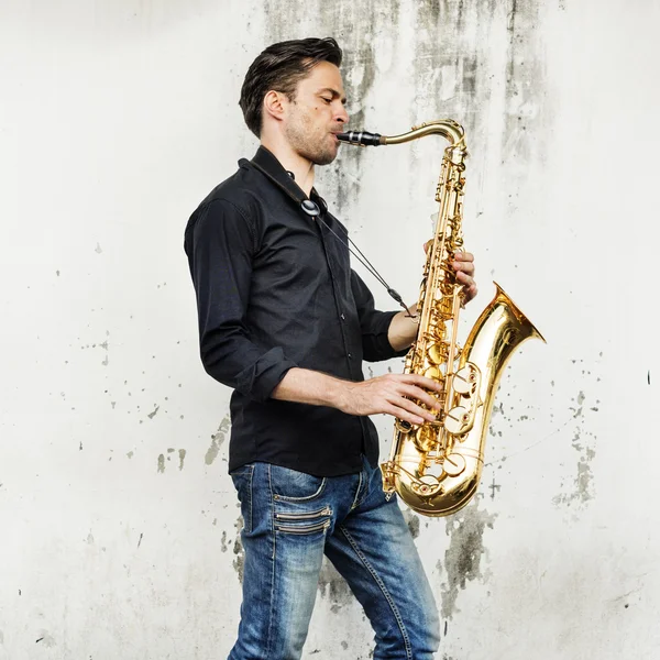 Young man with Saxophone Stock Photo by ©Rawpixel 128515058