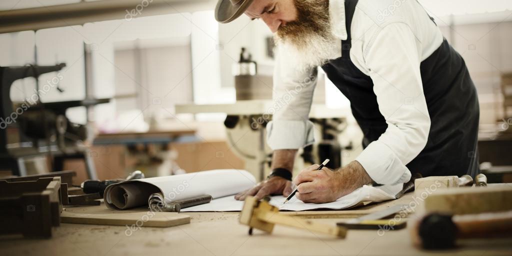 Handsome Craftsman at work — Stock Photo © Rawpixel #116407766
