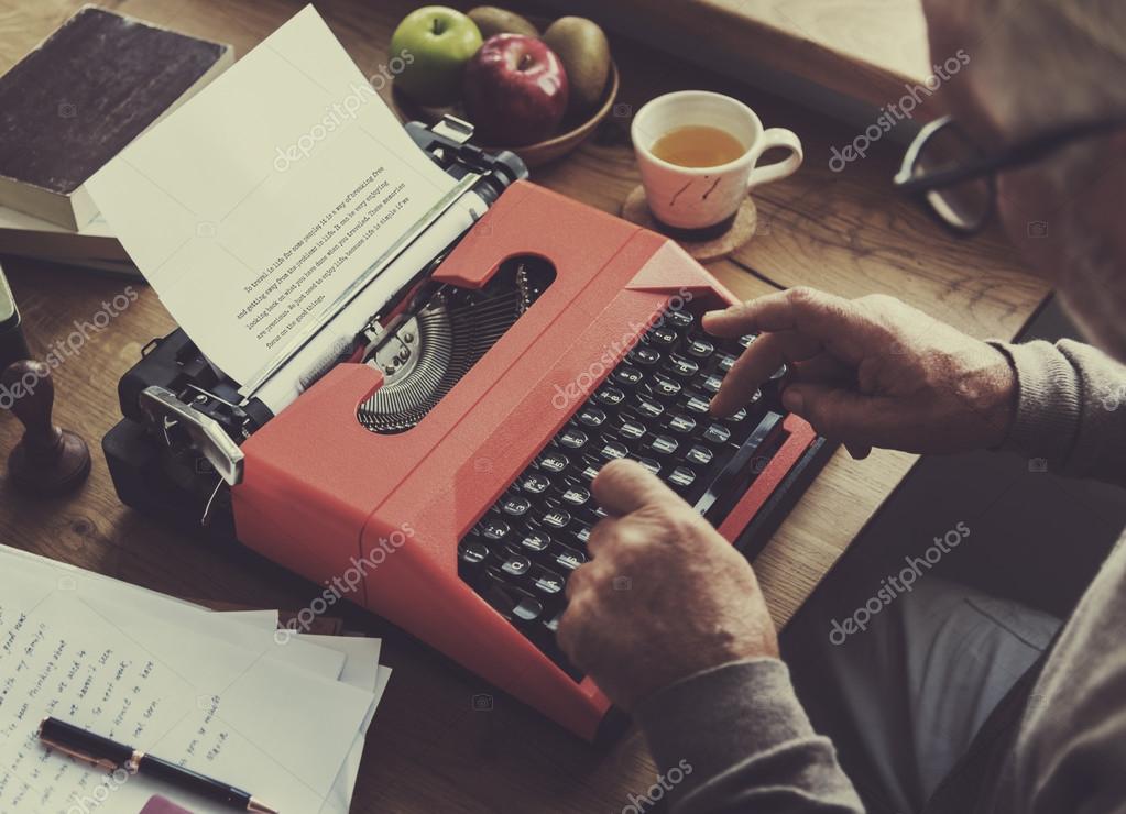 Senior man writing on typewriter machine — Stock Photo © Rawpixel ...