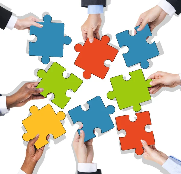 People holding the colorful puzzle pieces — Stock Photo © alphaspirit ... People holding the colorful puzzle pieces — Stock Photo © alphaspirit ...
