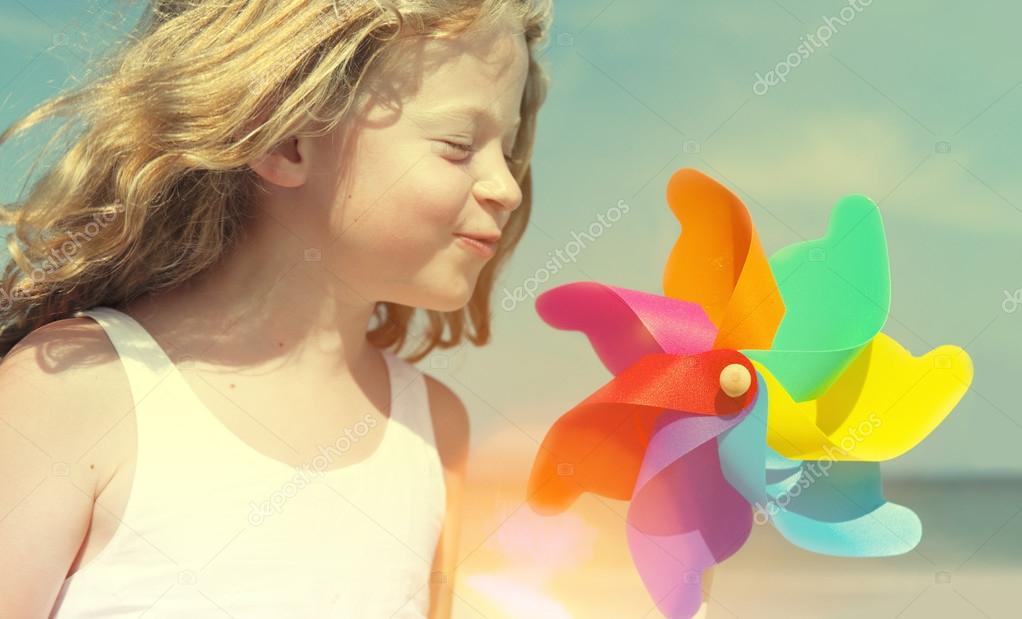 Little girl Blowing Windmill Concept — Stock Photo © Rawpixel #86295318 Little girl Blowing Windmill Concept — Stock Photo © Rawpixel #86295318