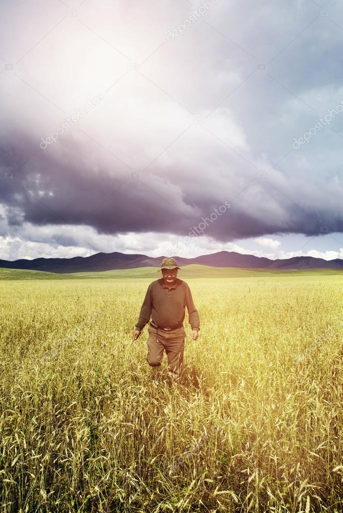 Man standing in field — Stock Photo © Rawpixel #97532328