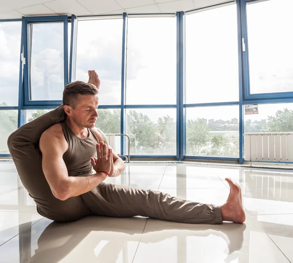 Athletic muscular young man working out, yoga — Stock Photo © tolstnev ...