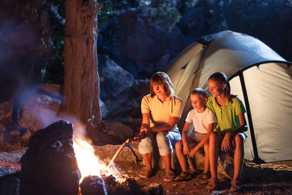 Family at the camping at night - Stock Image - Everypixel