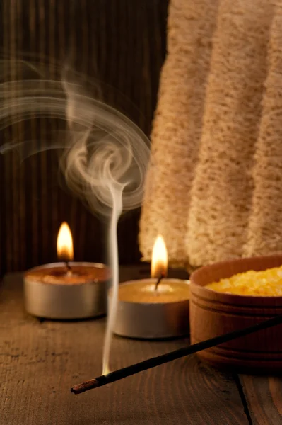 Spa setting and fuming aroma stick on wooden background - Stock Image ...
