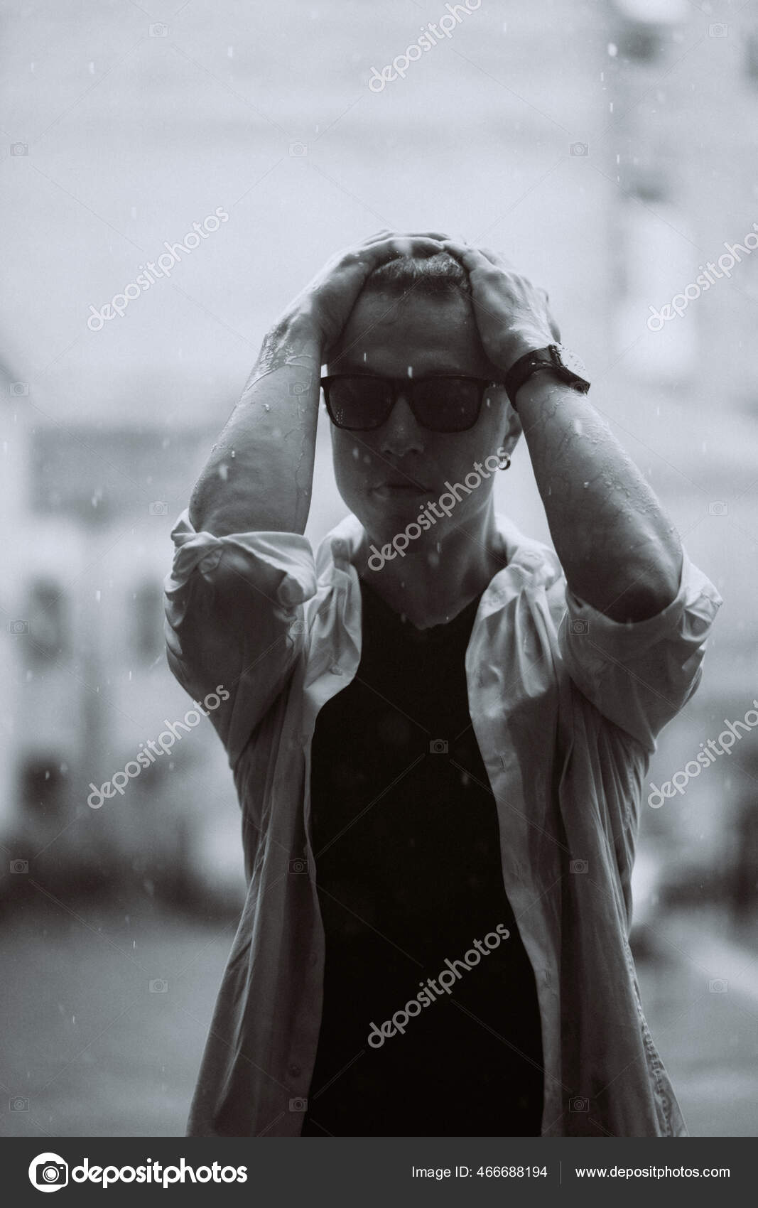 Portrait of carefree handsome young man is feeling free under the rain ... Portrait of carefree handsome young man is feeling free under the rain ...