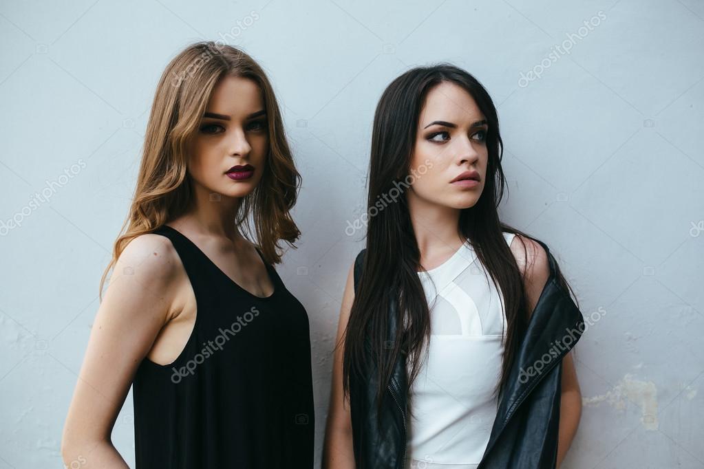 Two beautiful friends pose on white background — Stock Photo ...
